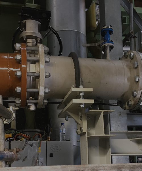 Tico pipe suppports attached to a large industrial pipe system